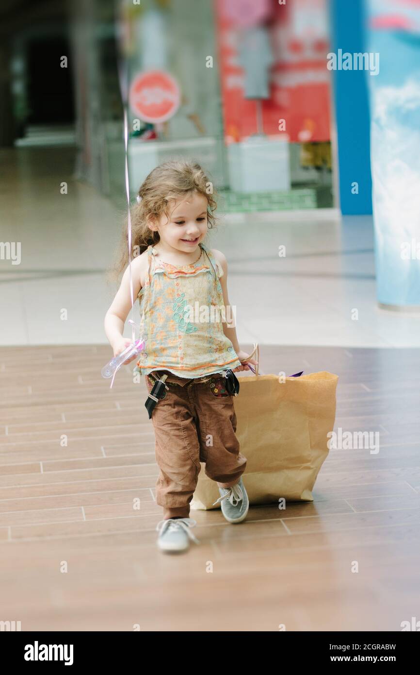 Beautiful girl having fun on the store Stock Photo - Alamy