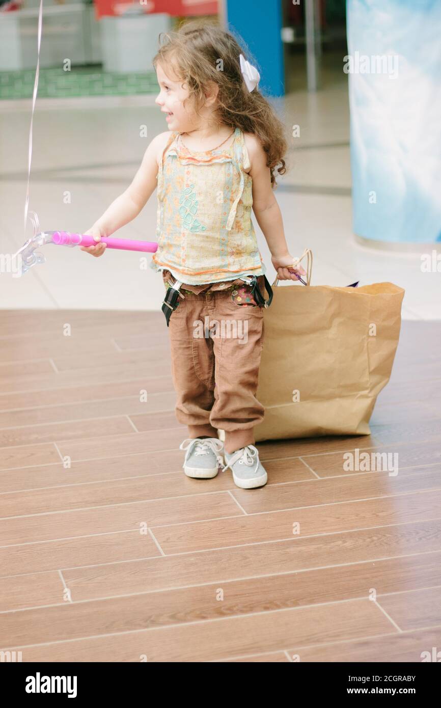 Beautiful girl having fun on the store Stock Photo - Alamy