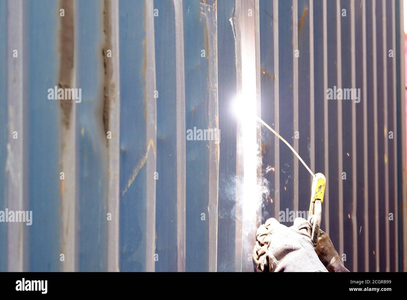 Believe the container wall Container repair Stock Photo - Alamy