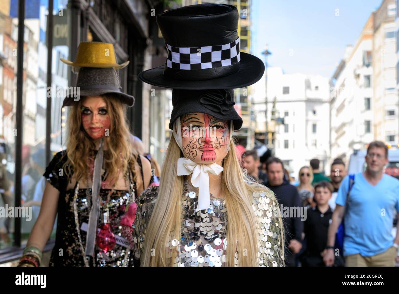 Mayfair, London, UK, 22 Jun 2019. Models walk along a Mayfair street in ...