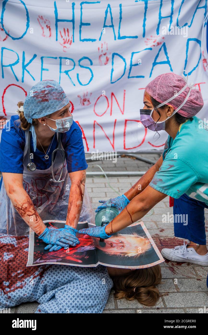 London, UK. 12th Sep, 2020. Nurses pretend to resuscitate a cartoon ...