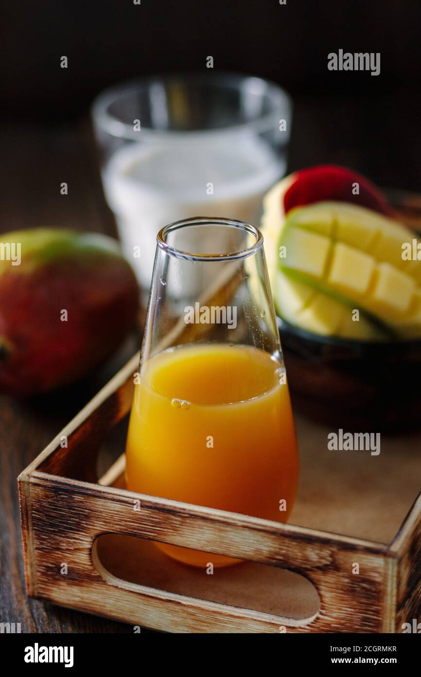 Mango juice in transparent glass juice hi-res stock photography and ...