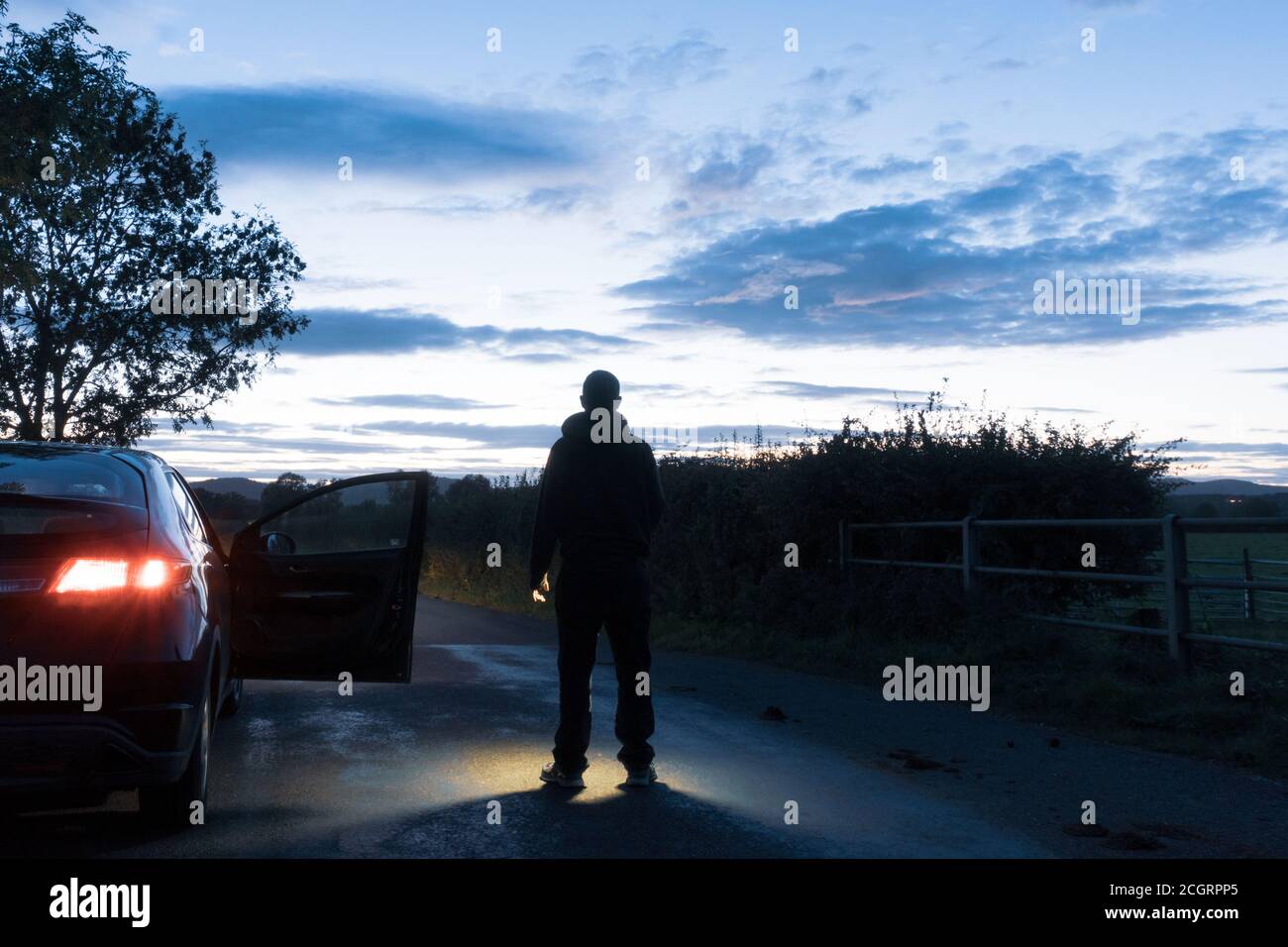 Man standing car lane summer hi-res stock photography and images - Alamy