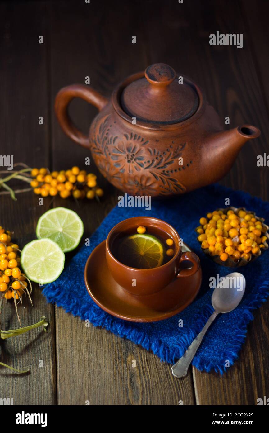 Sea buckthorn tea with lime, ready to drink Stock Photo - Alamy