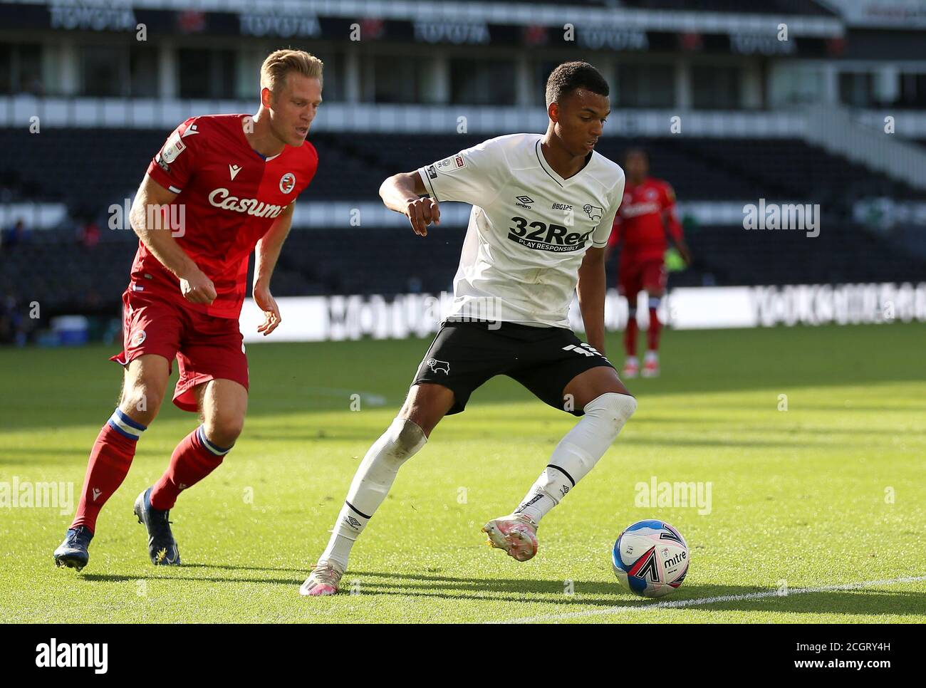 Reading's Michael Morrison (left) and Derby County's Morgan Whittaker ...
