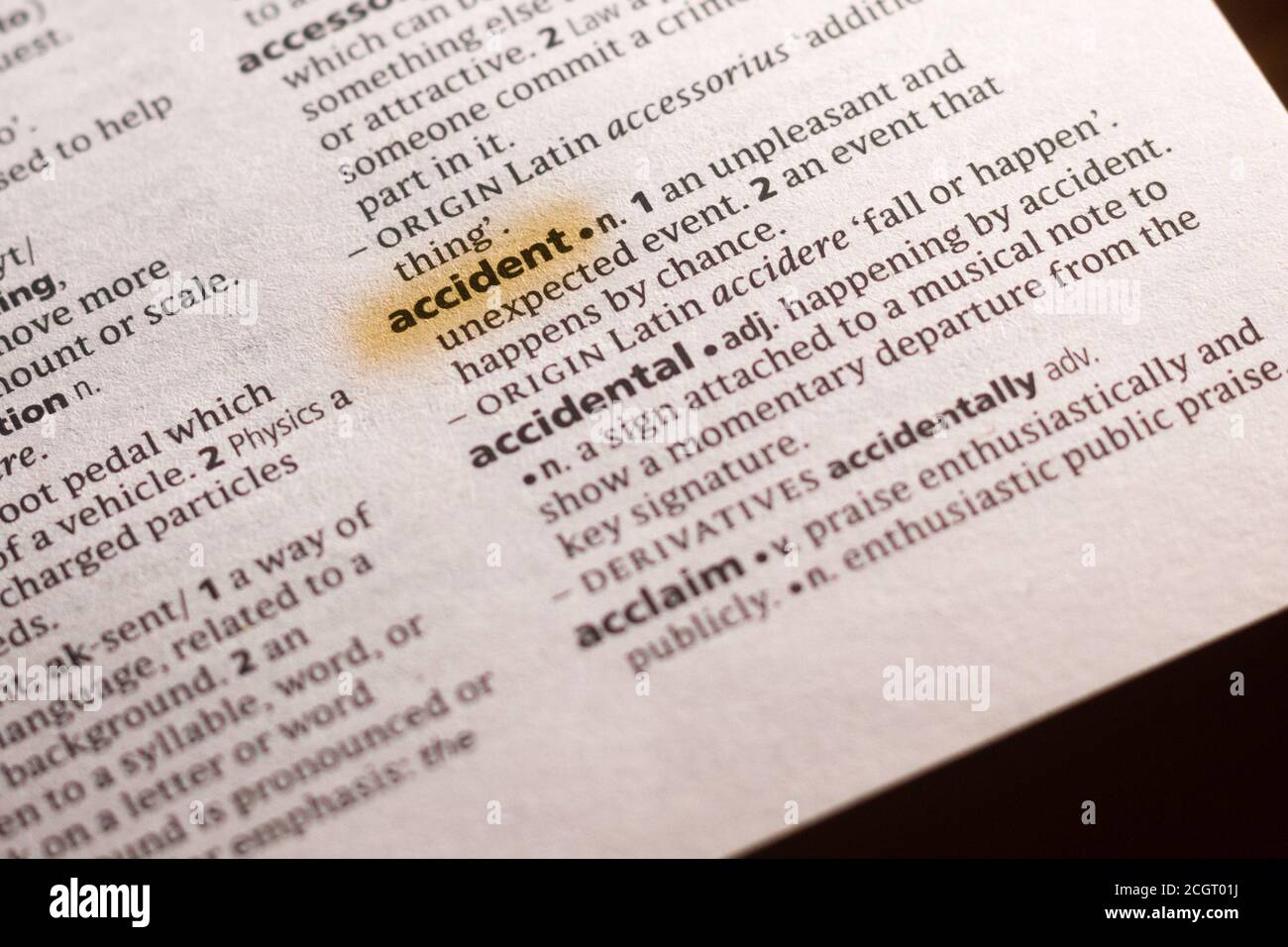 The word or phrase Accident in a dictionary highlighted with marker ...