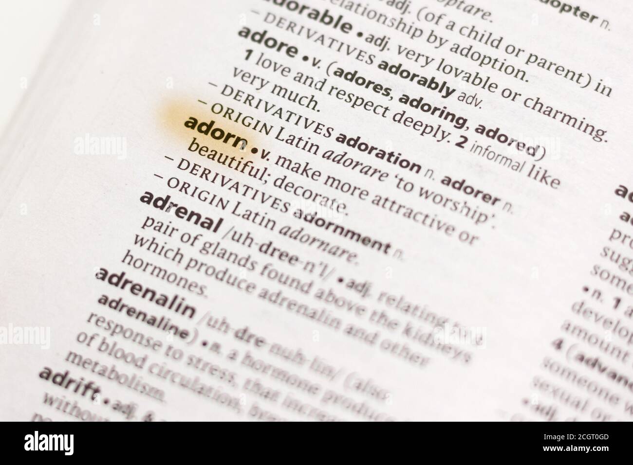 The word or phrase Adorn in a dictionary highlighted with marker Stock ...
