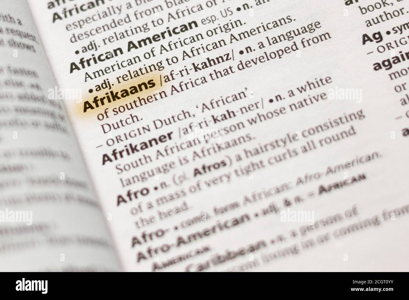 The word or phrase Afrikaans in a dictionary highlighted with marker ...