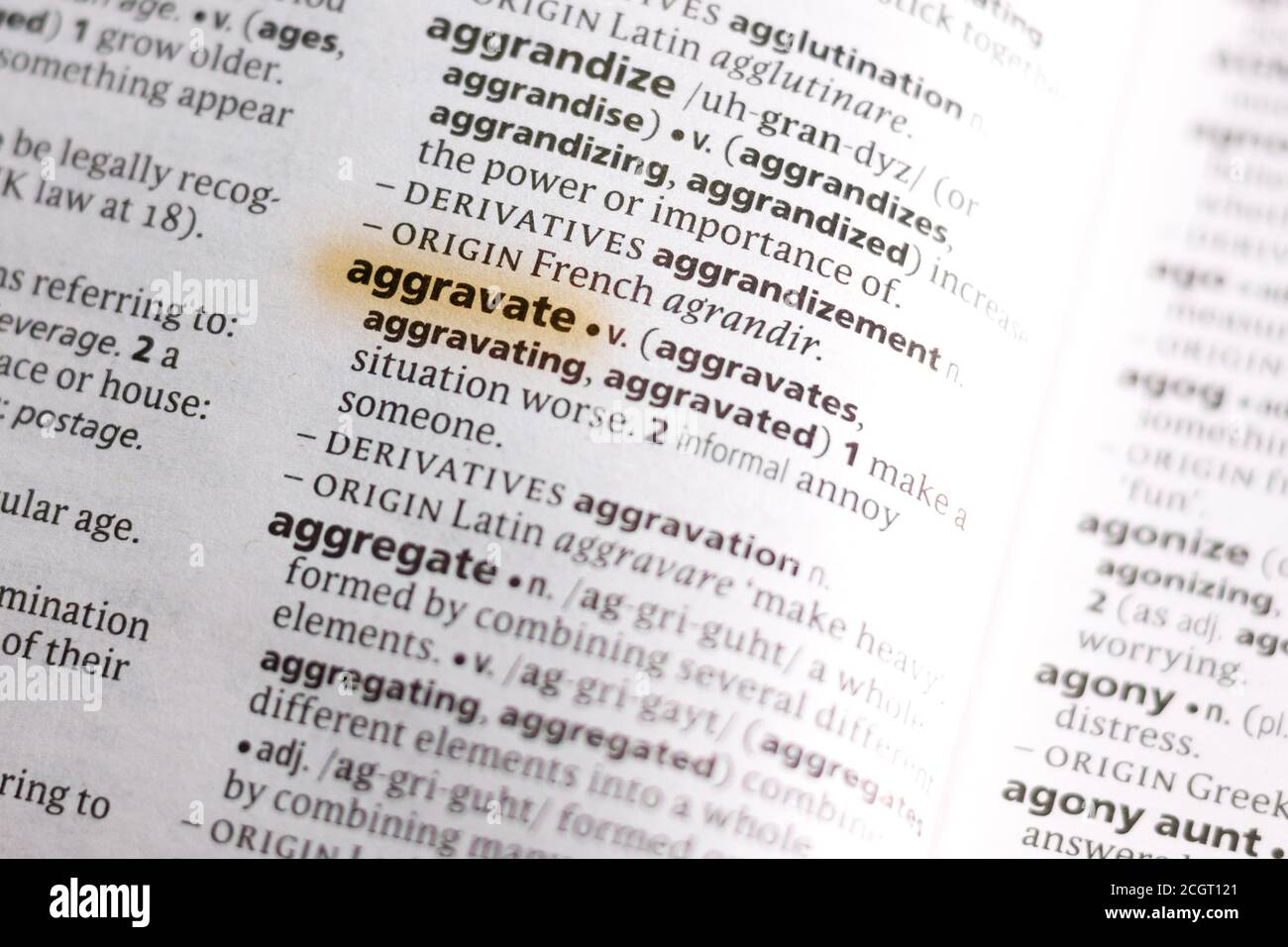 The word or phrase Aggravate in a dictionary highlighted with marker ...