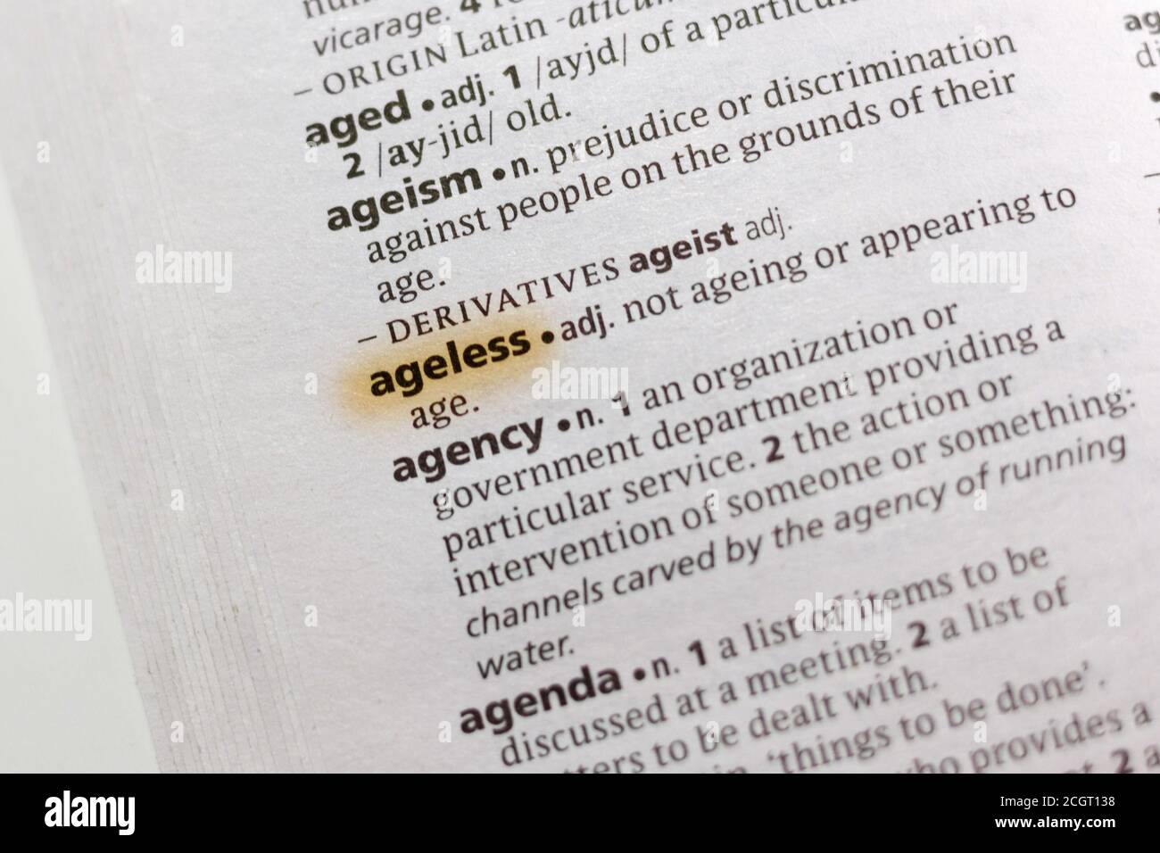 The word or phrase Ageless in a dictionary highlighted with marker ...