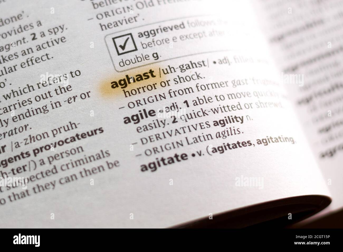 The word or phrase Aghast in a dictionary highlighted with marker Stock ...