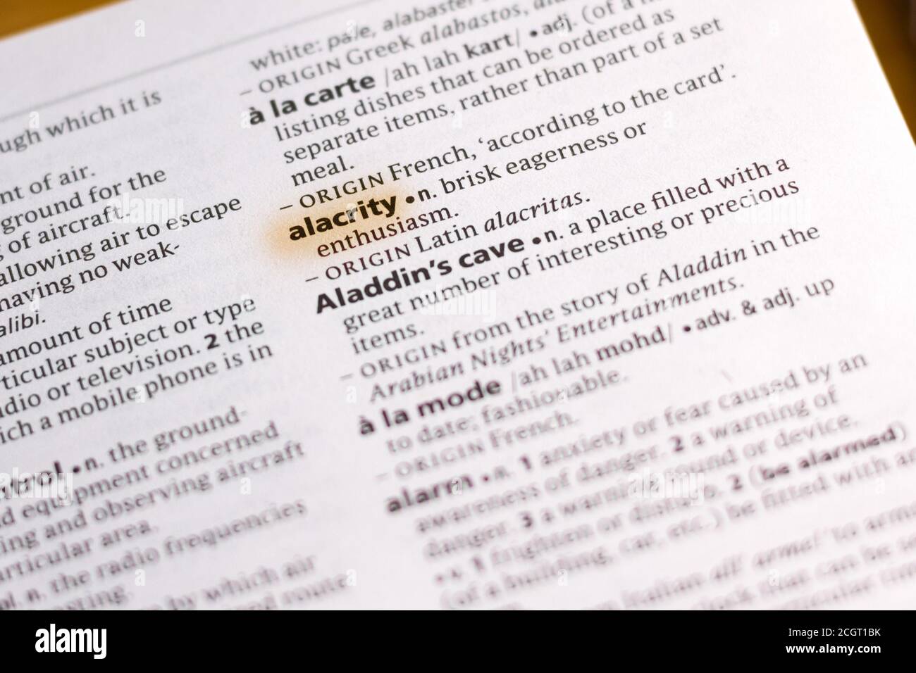The word or phrase Alacrity in a dictionary highlighted with marker ...