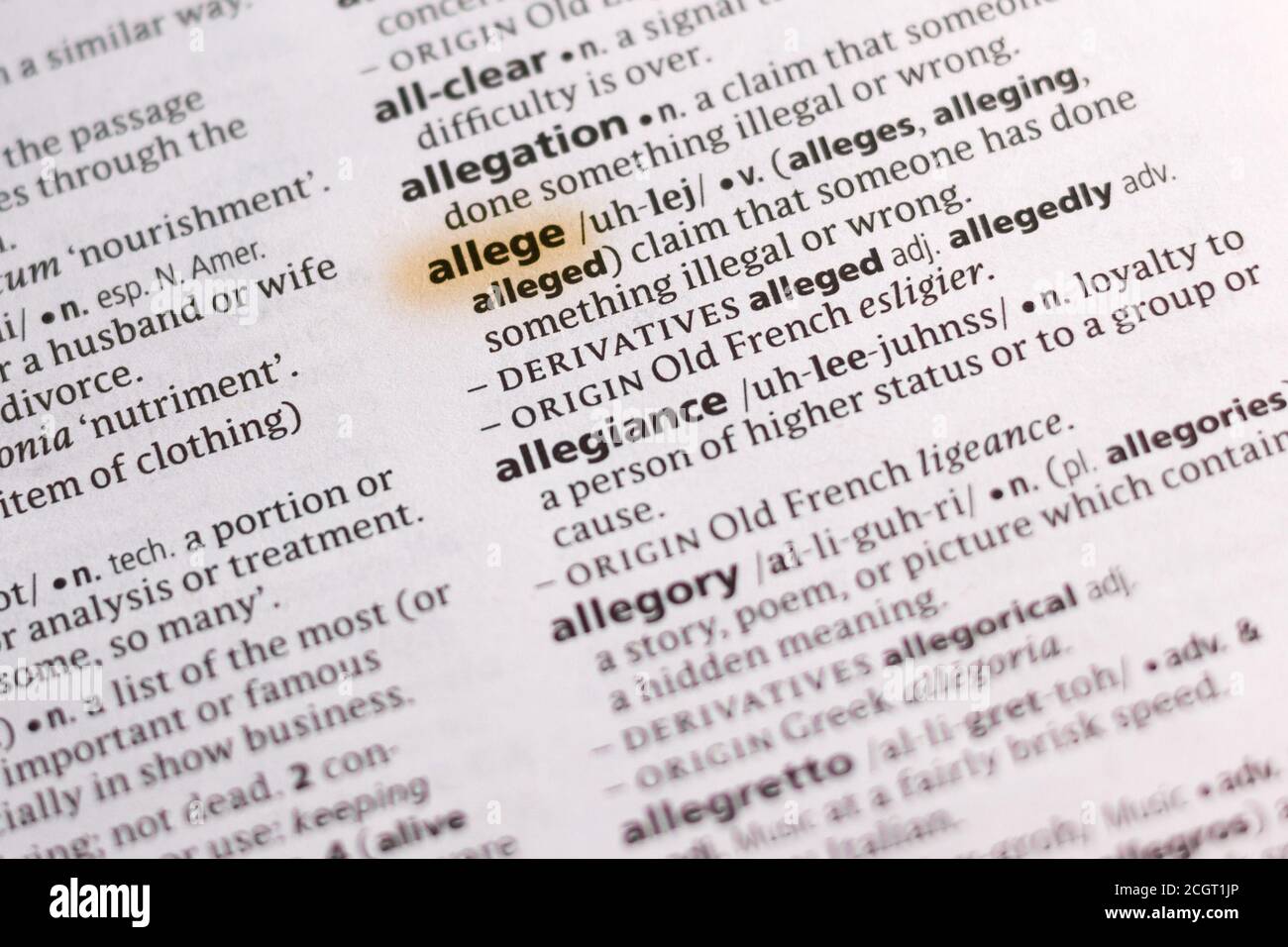 The word or phrase Allege in a dictionary highlighted with marker Stock ...