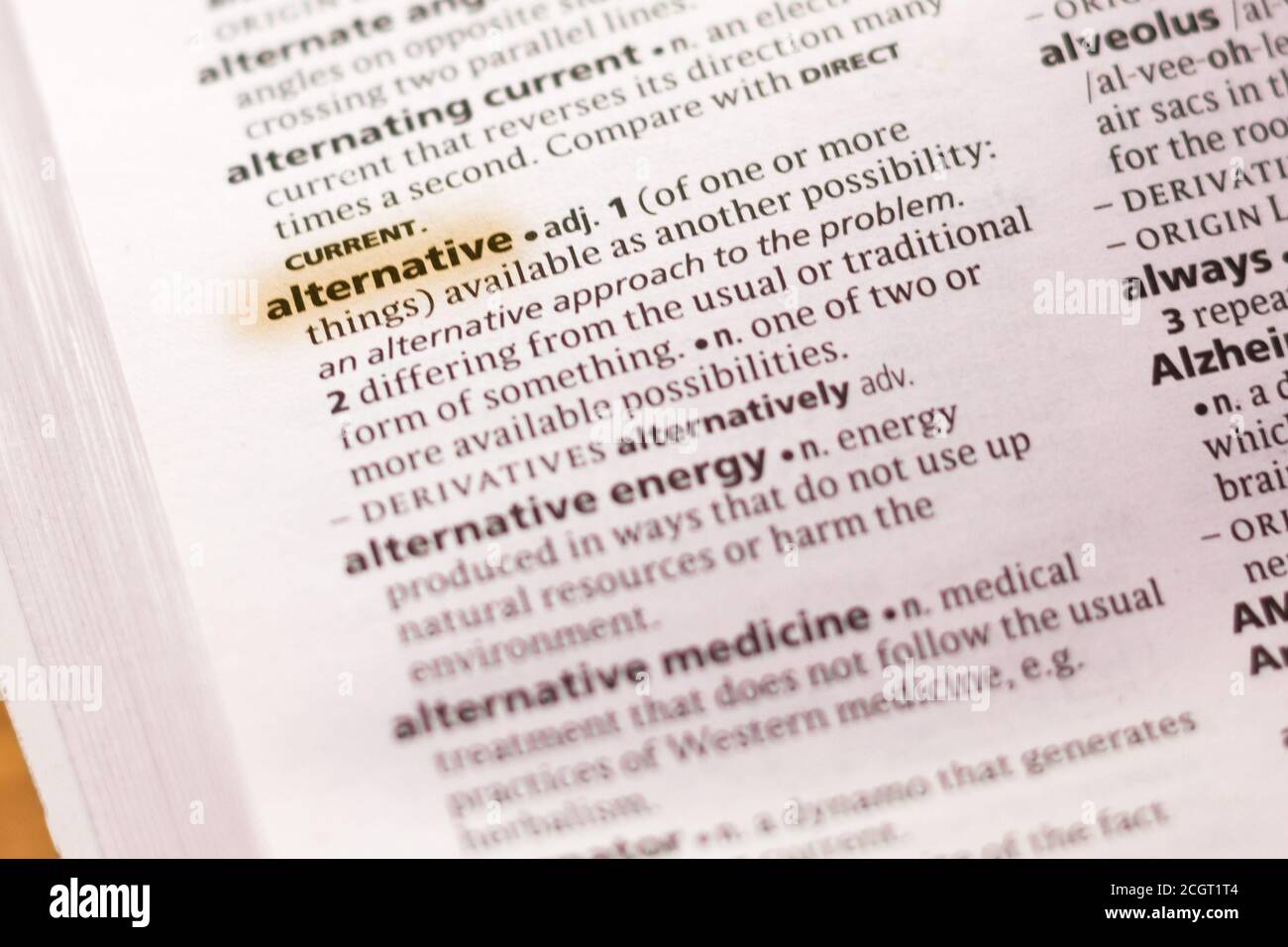 The word or phrase Alternative in a dictionary highlighted with marker ...