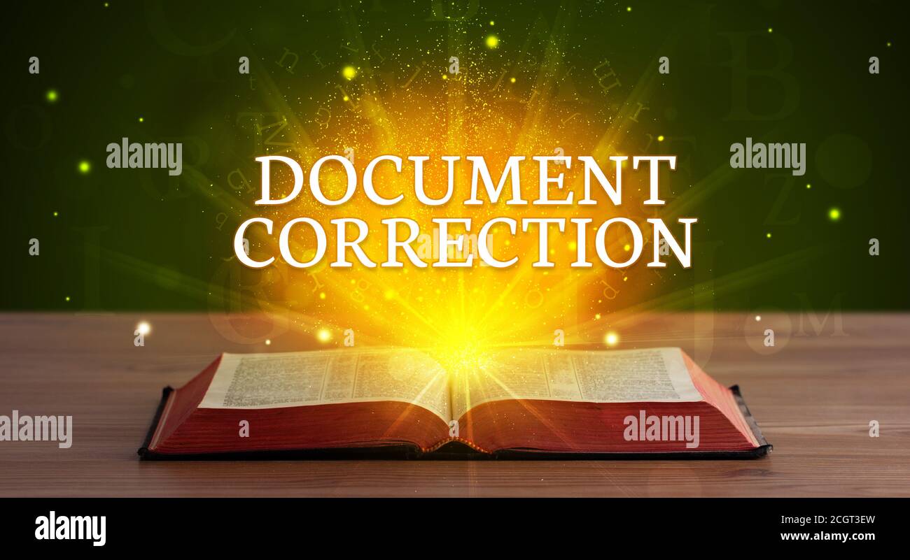 DOCUMENT CORRECTION inscription coming out from an open book ...