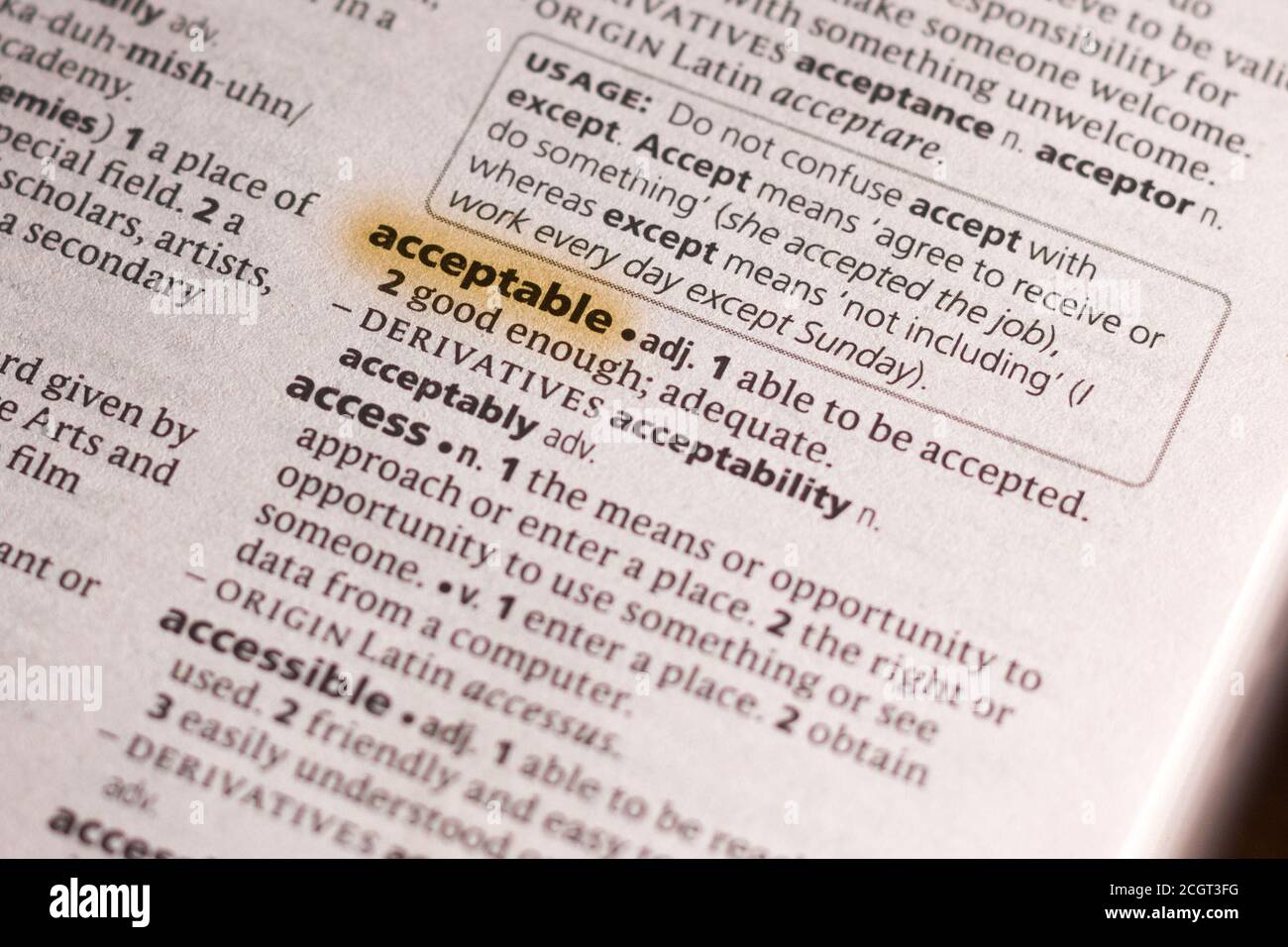 The word or phrase Acceptable in a dictionary highlighted with marker ...