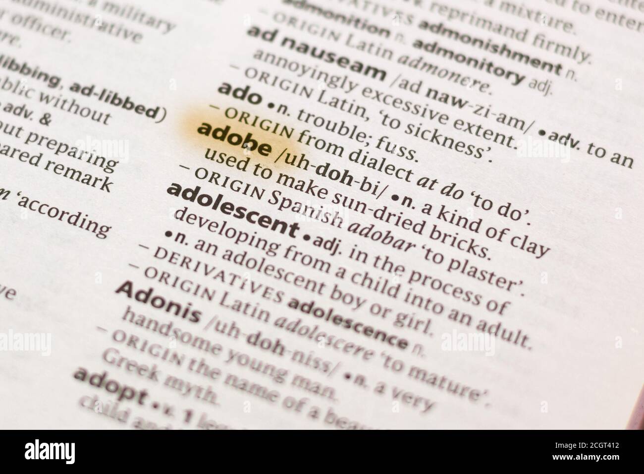 The word or phrase Adobe in a dictionary highlighted with marker Stock ...