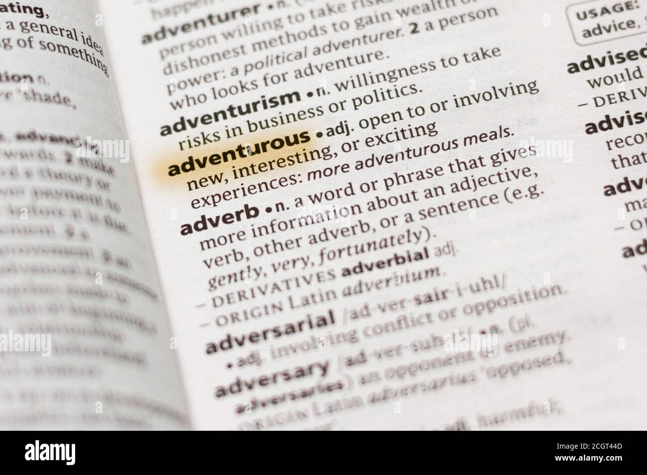 The word or phrase Adventurous in a dictionary highlighted with marker ...