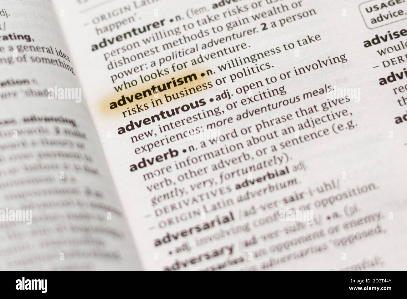The word or phrase Adventurism in a dictionary highlighted with marker ...