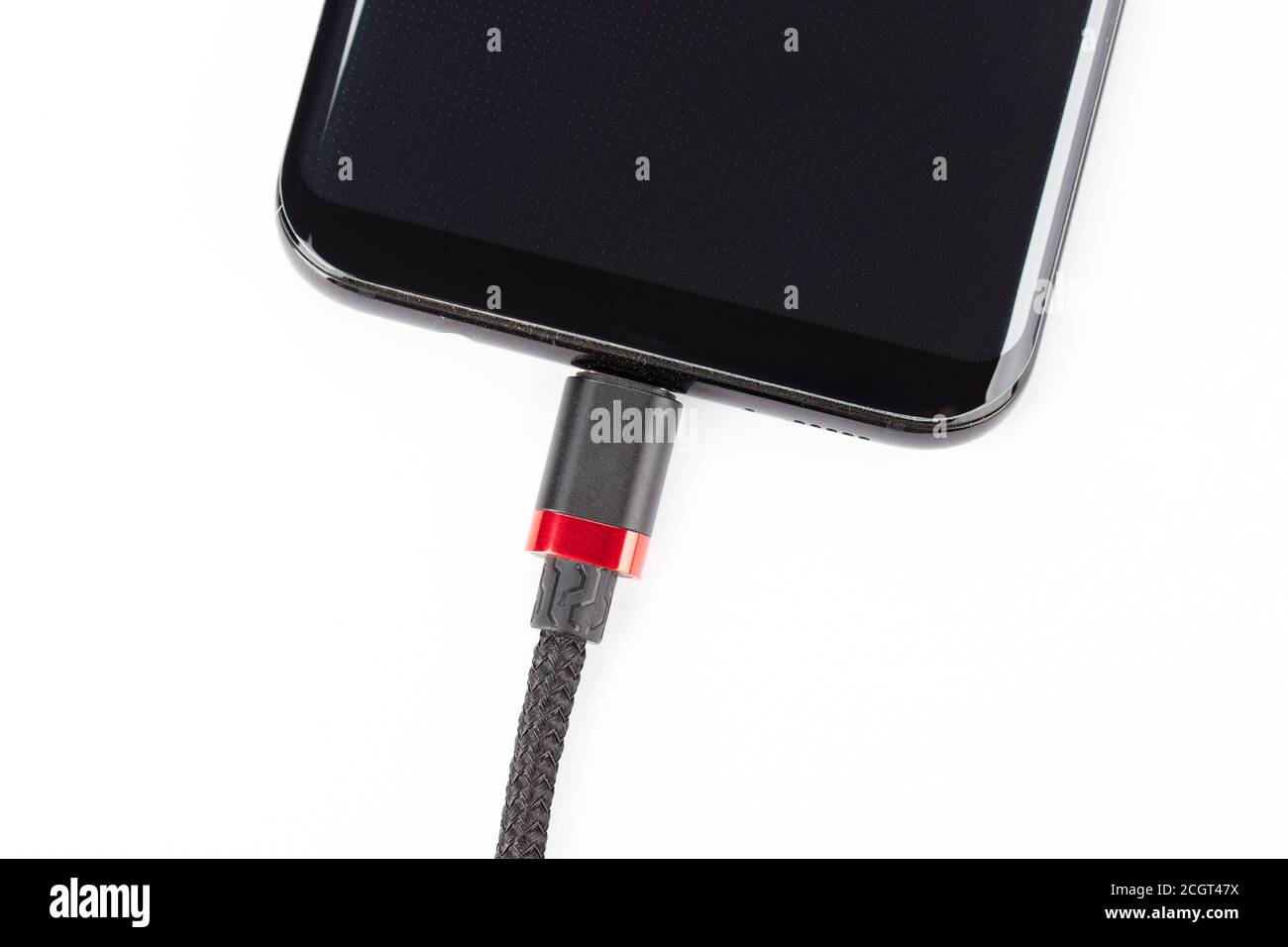 Smartphone Connects to Charger through USB Cable on a white background ...