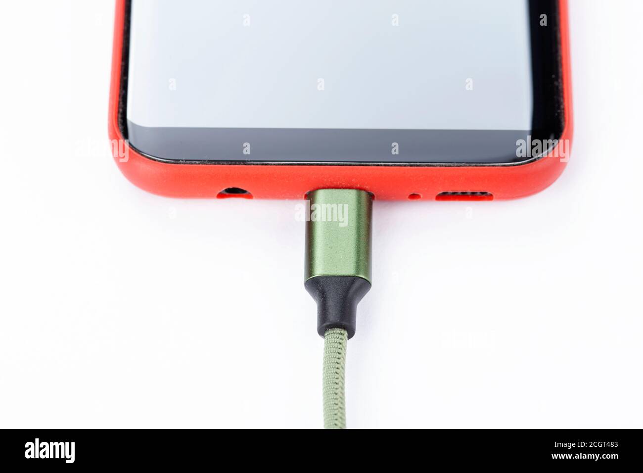 Smartphone Connects to Charger through USB Cable on a white background ...