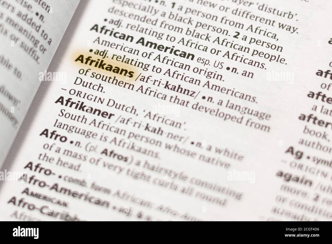 The word or phrase Afrikaans in a dictionary highlighted with marker ...