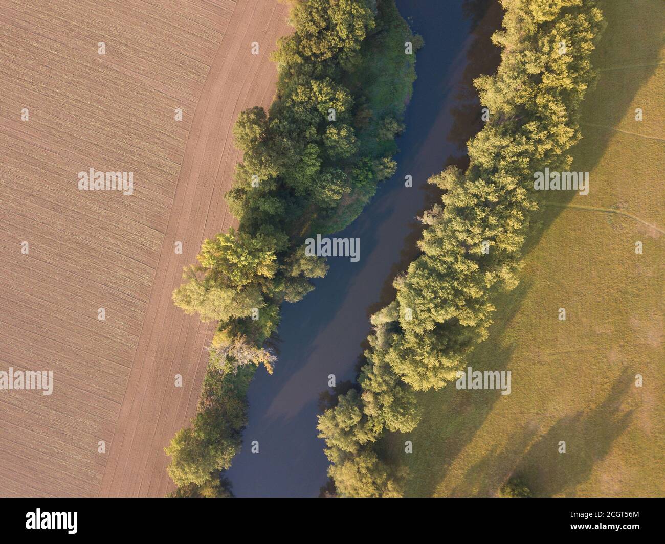 Top view of the river with turns of meanders and green forests in ...