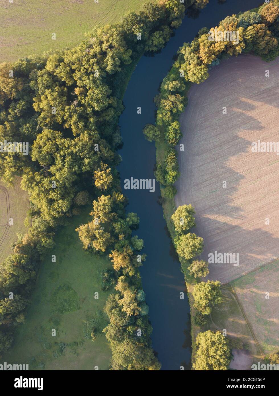 Top view of the river with turns of meanders and green forests in ...