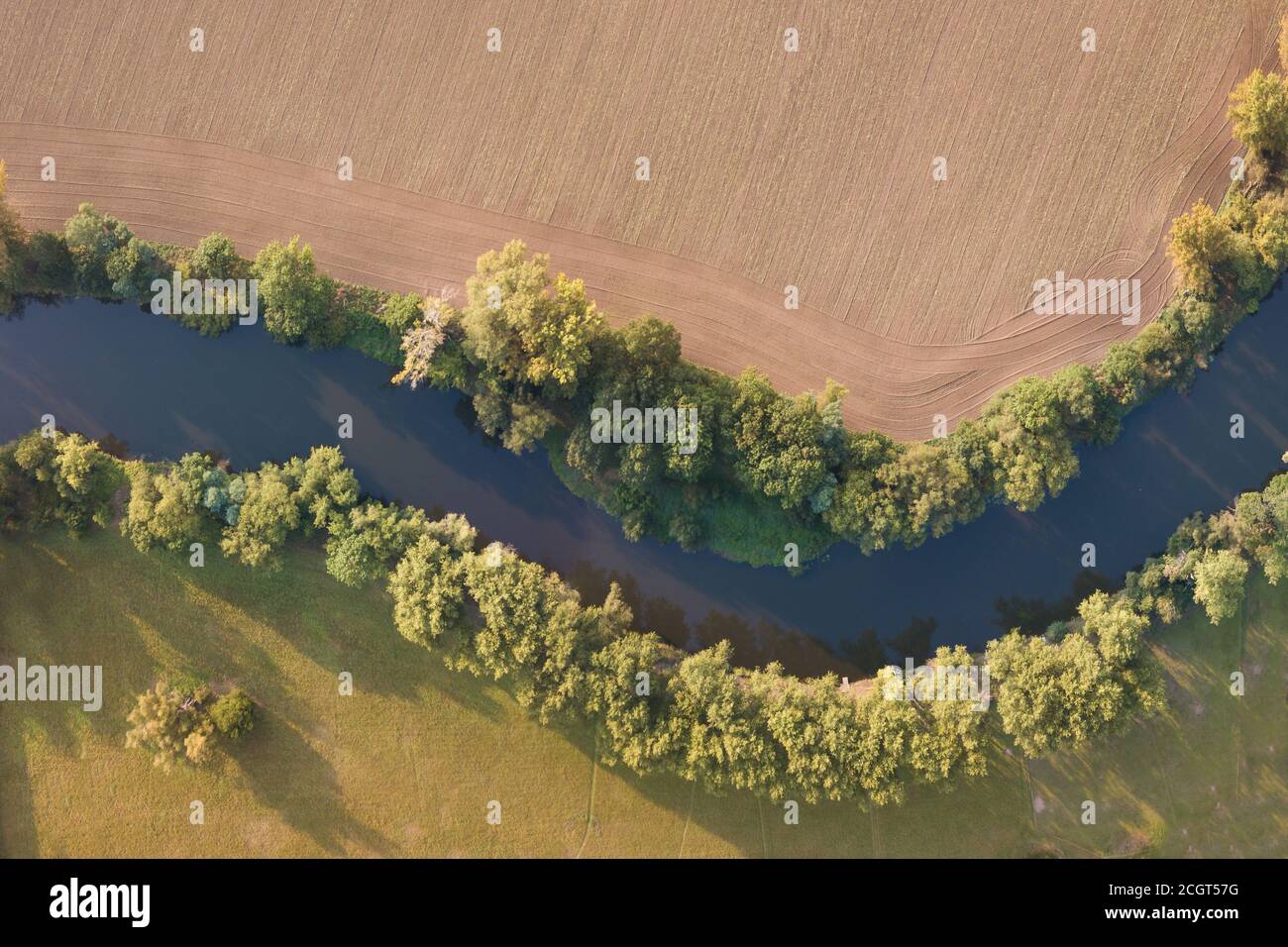 Top view of the river with turns of meanders and green forests in ...