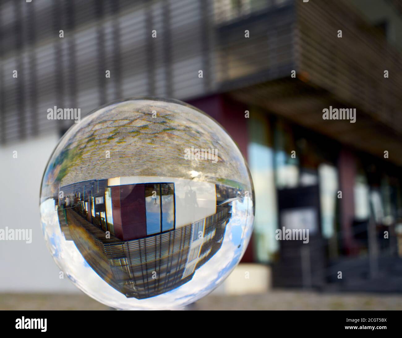 Upside down modern building in a crystal ball Stock Photo - Alamy