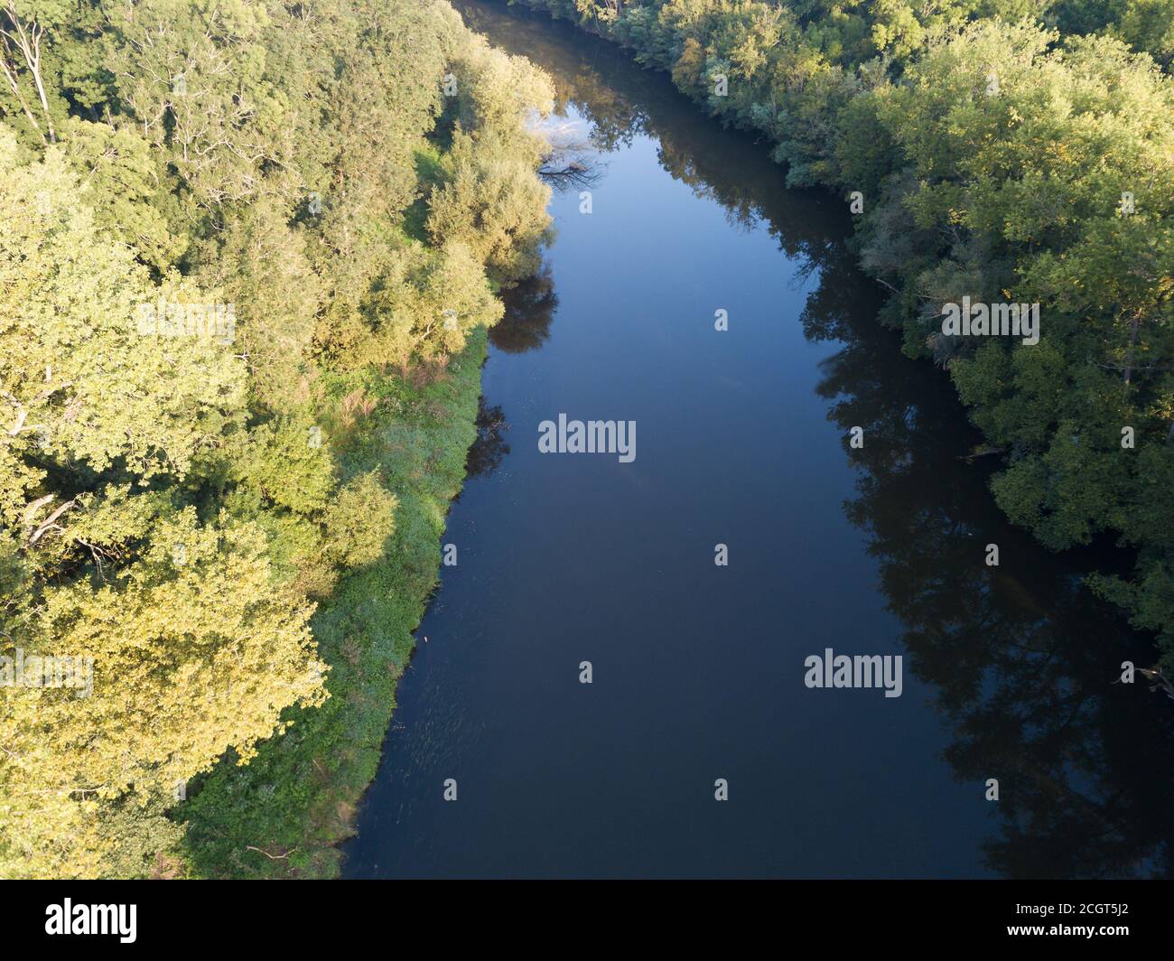 Top view of the river with turns of meanders and green forests in ...