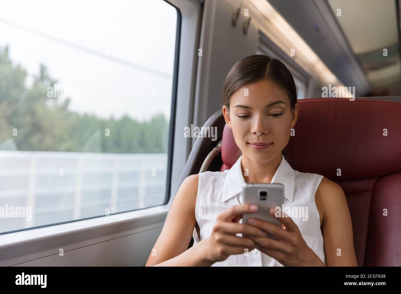 People using phones train hi-res stock photography and images - Alamy
