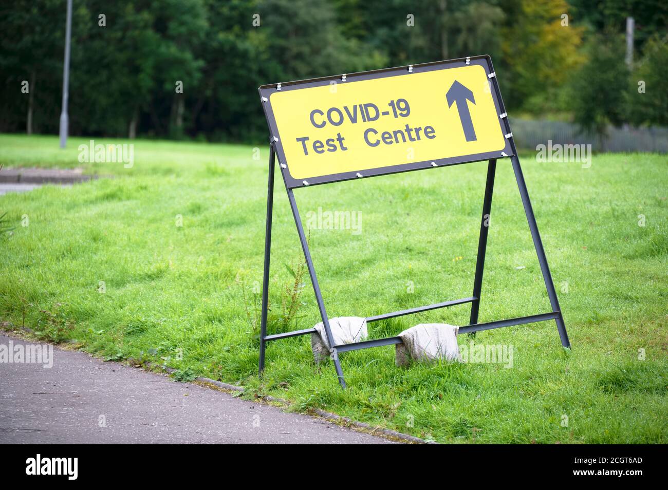 Covid-19 test centre sign at road with traffic cones Stock Photo - Alamy