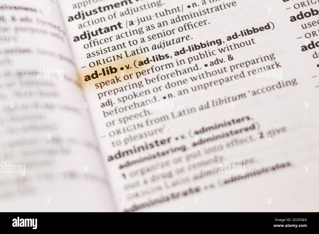 The word or phrase Ad-Lib in a dictionary highlighted with marker Stock ...