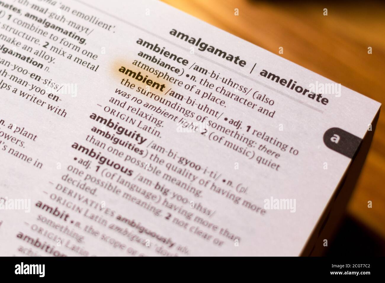 The word or phrase Ambient in a dictionary highlighted with marker ...
