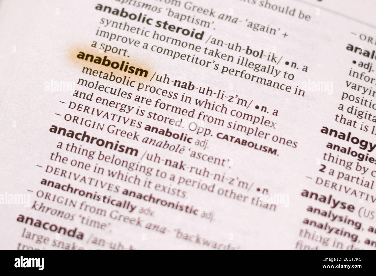 The word or phrase Anabolism in a dictionary highlighted with marker ...