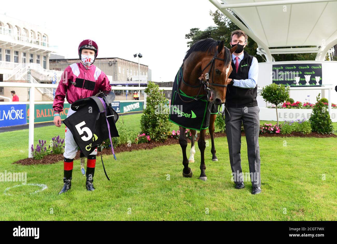 Colin Keane and Safe Voyage with groom Sean Grassick after winning the Clipper Logistics ...
