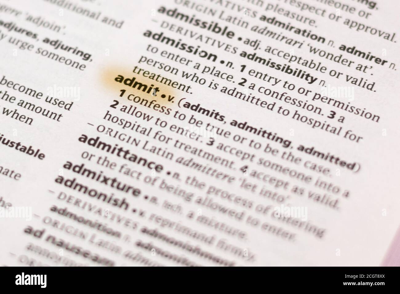 The word or phrase Admit in a dictionary highlighted with marker Stock ...