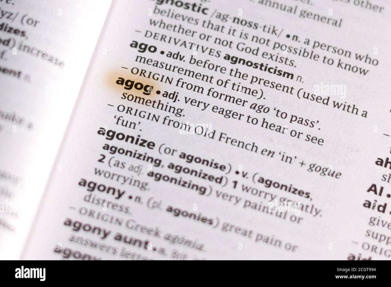 The word or phrase Agog in a dictionary highlighted with marker Stock ...