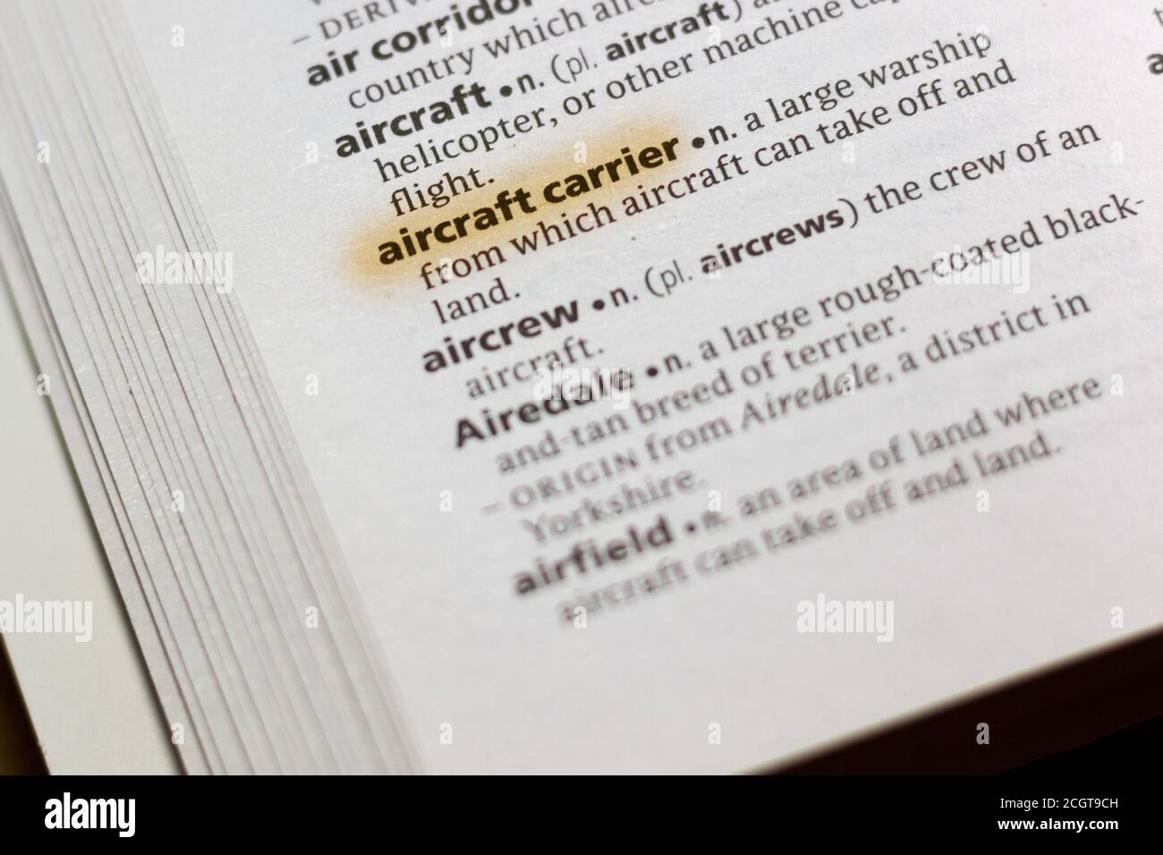 The word or phrase Aircraft Carrier in a dictionary highlighted with ...