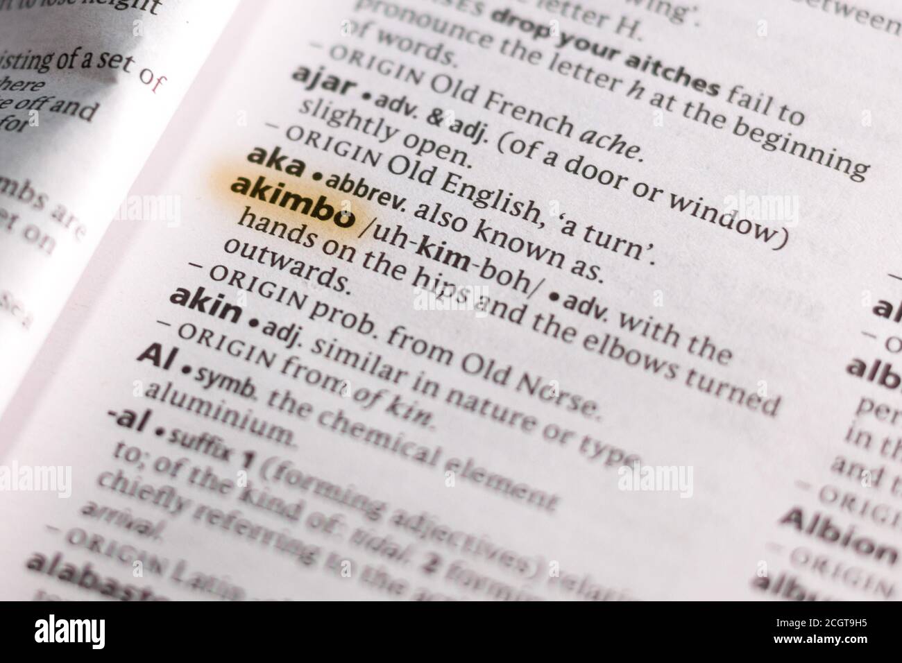 The word or phrase Akimbo in a dictionary highlighted with marker Stock ...