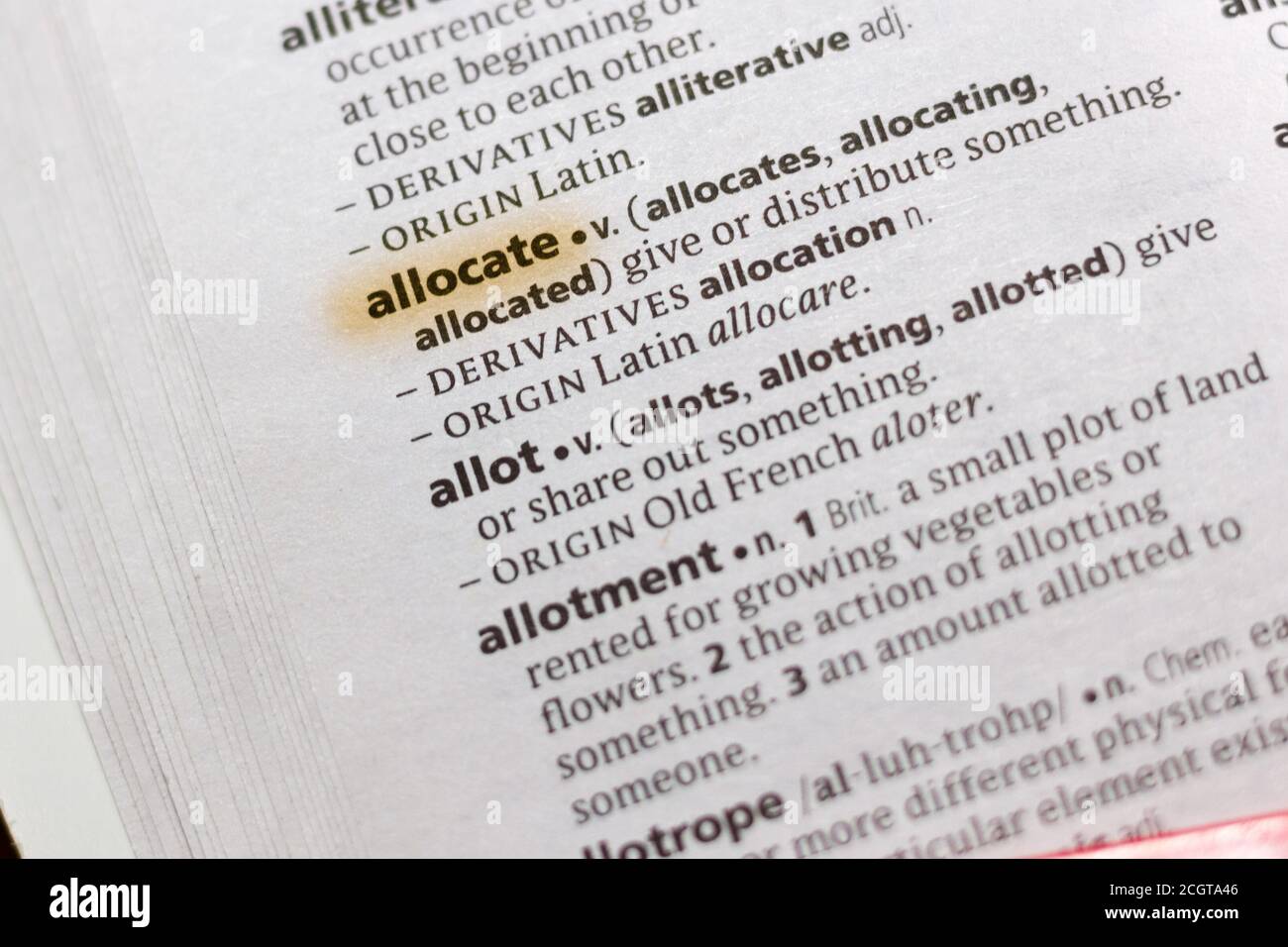 The word or phrase Allocate in a dictionary highlighted with marker ...