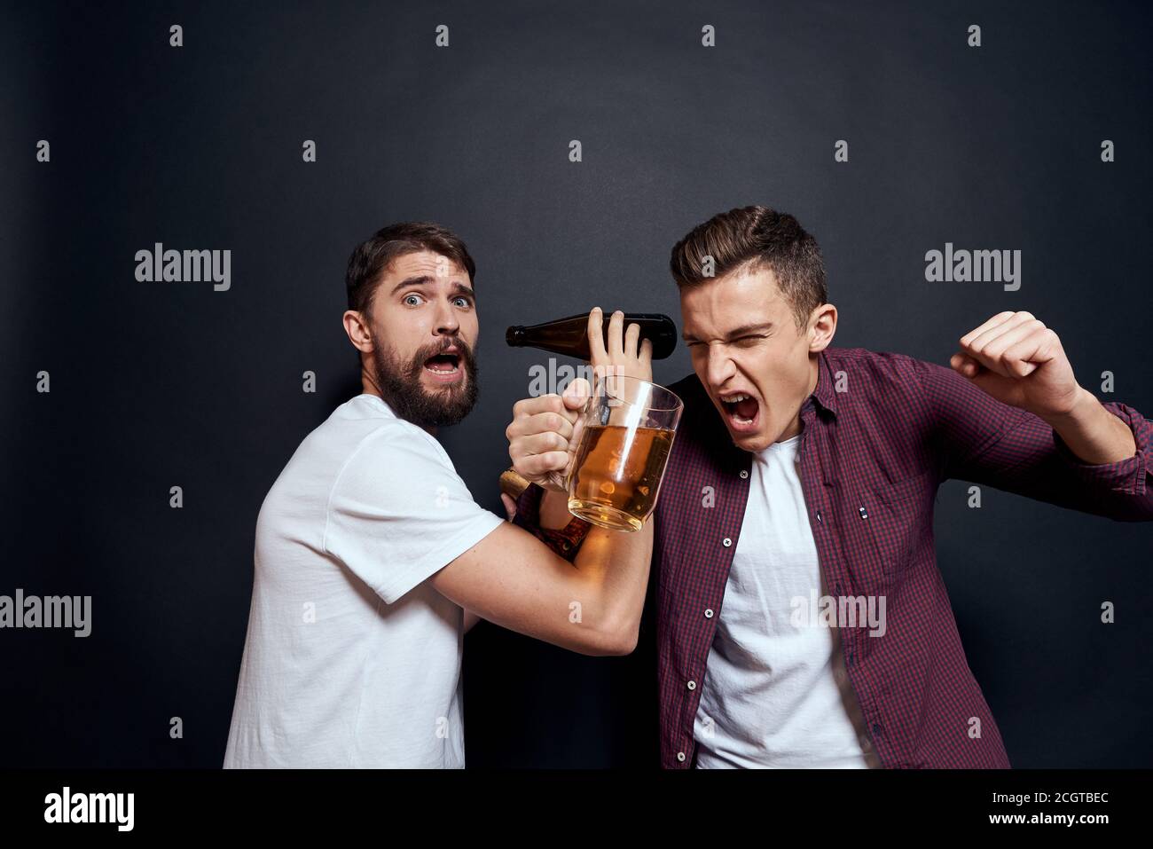 Two drunk friends drinking beer rest fun dark background Stock Photo ...