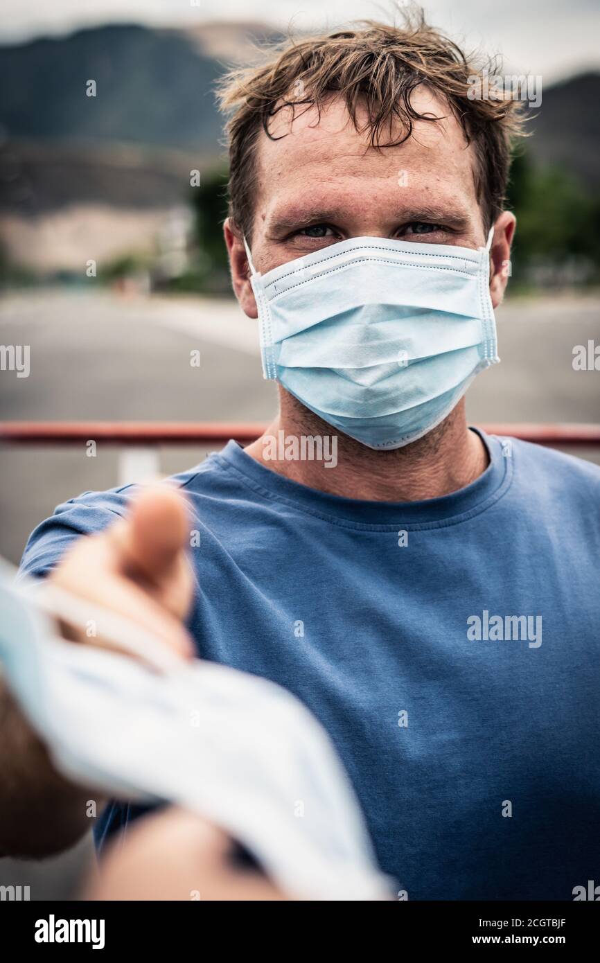 Close up serious Man Wearing blue Medical Mask giving gesture looking ...