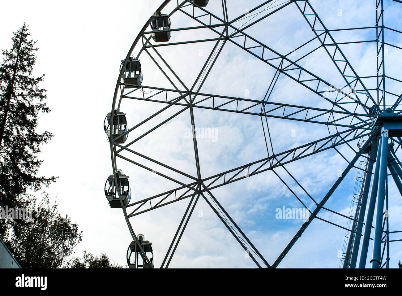 Ferris wheel in an amusement park. Outdoor entertainment Stock Photo ...