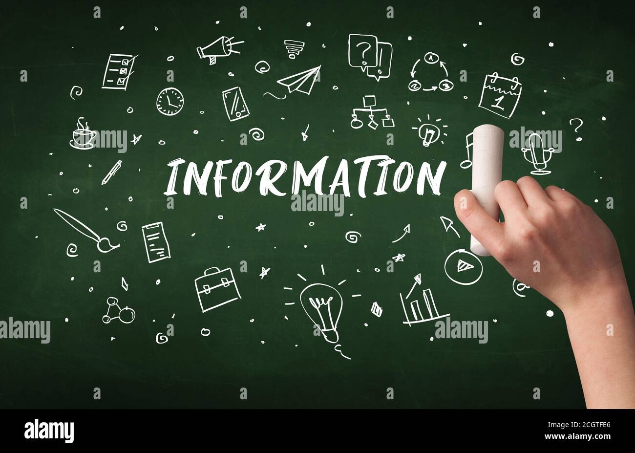 Hand drawing INFORMATION inscription with white chalk on blackboard ...