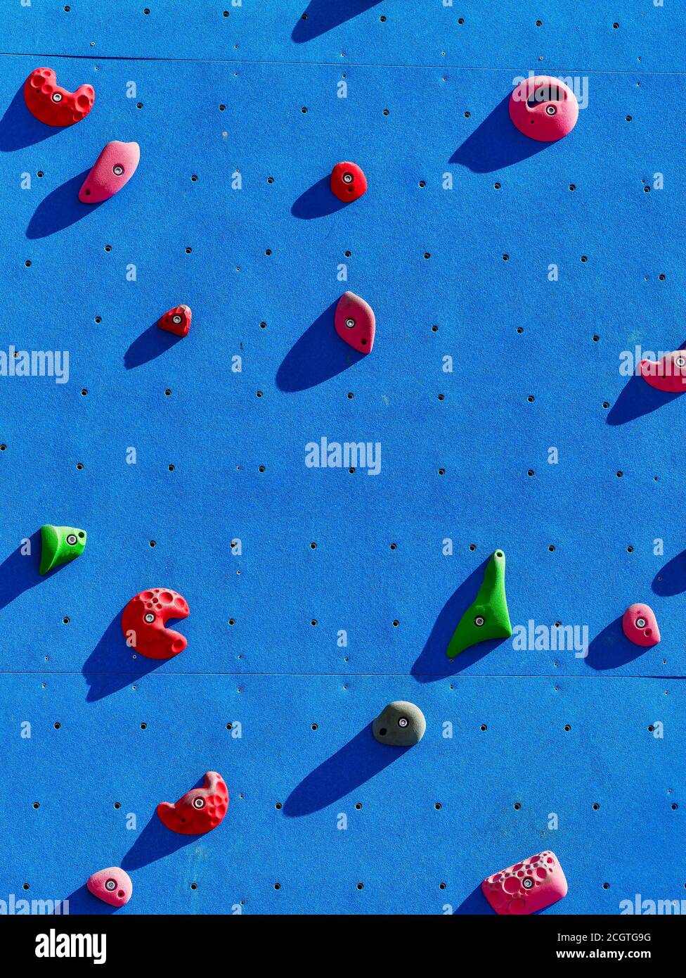 Blue wall with climbing holds outdoor Stock Photo - Alamy