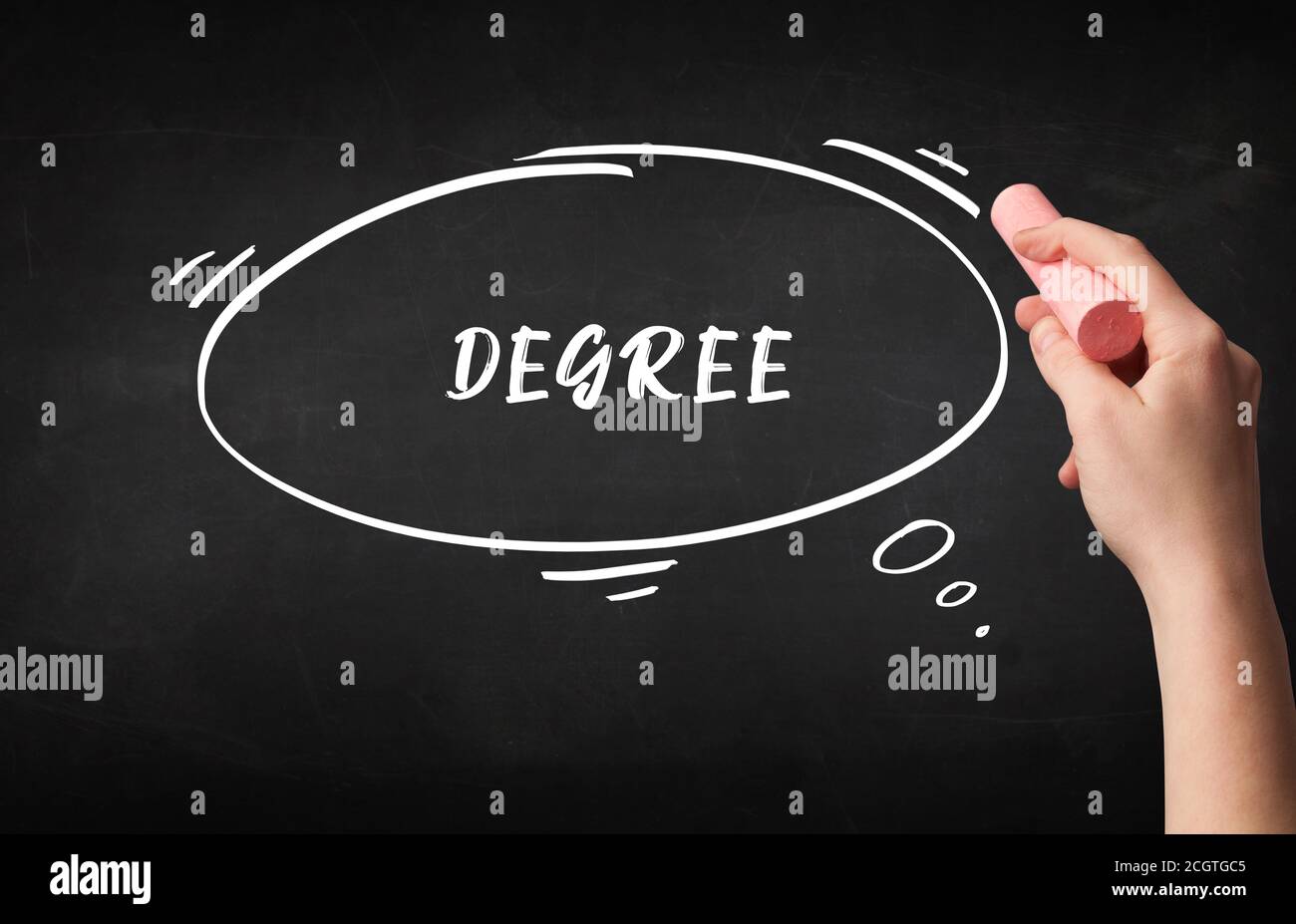 Hand drawing DEGREE inscription with white chalk on blackboard ...