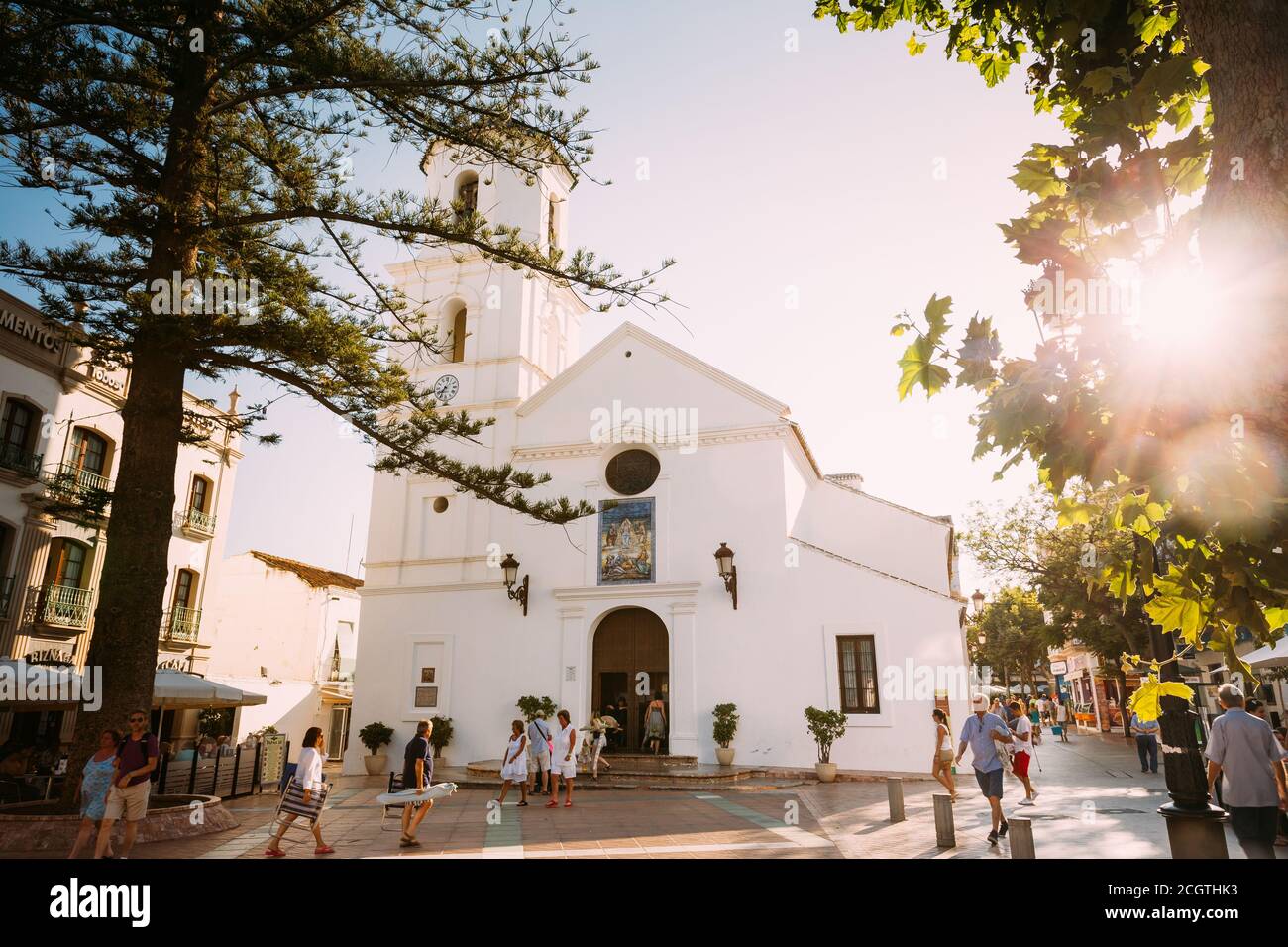 People walking near church of El Salvador in Nerja, Spain Stock Photo ...