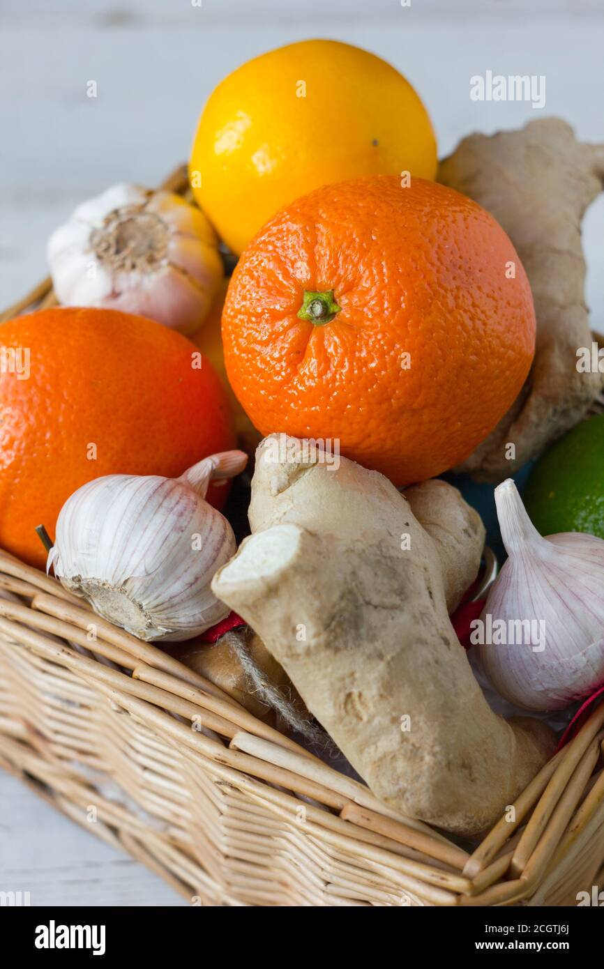 Citrus fruits, garlic and ginger root on basket Stock Photo - Alamy